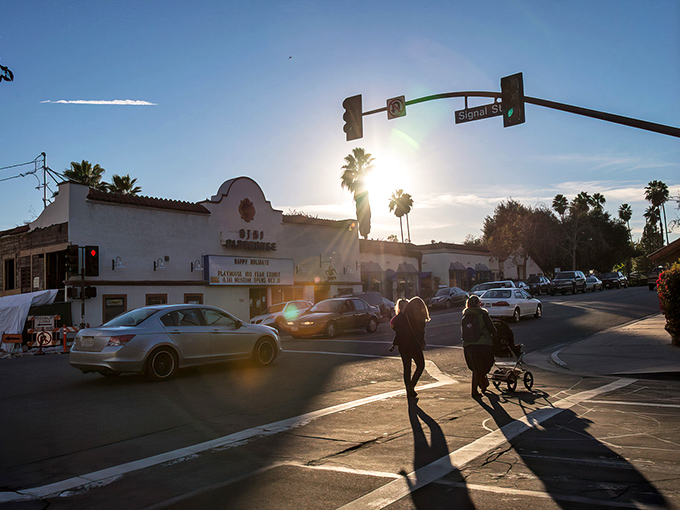 Ojai's downtown glows in the golden hour light, where palm trees and historic architecture create California's most perfect small-town moment.