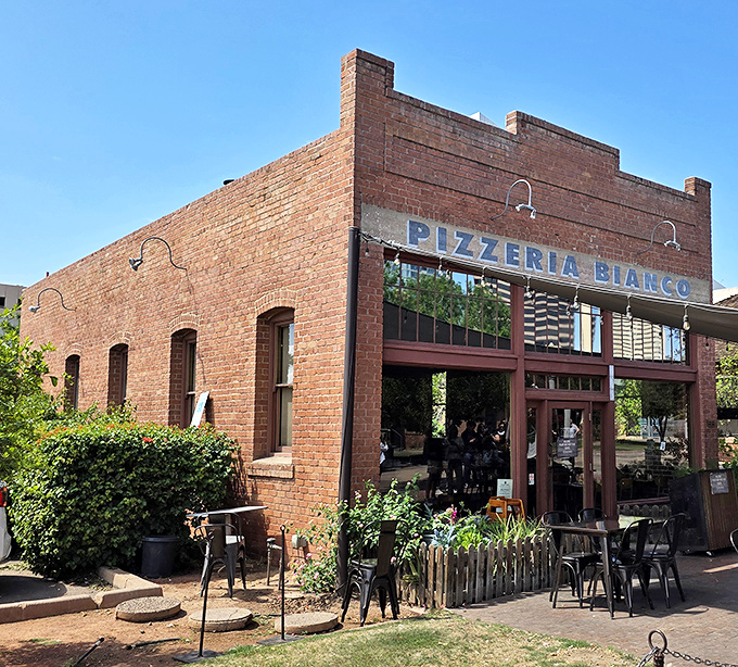 Pizzeria Bianco's historic brick building stands like a temple to perfect pizza, inviting you into a world of wood-fired magic.