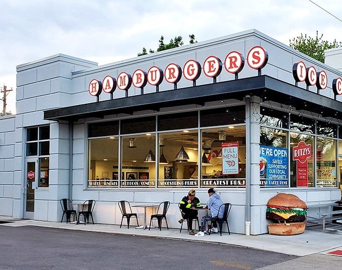 Ritzy's exterior gleams like a time capsule of burger perfection. That giant "HAMBURGERS" sign isn't kidding around!