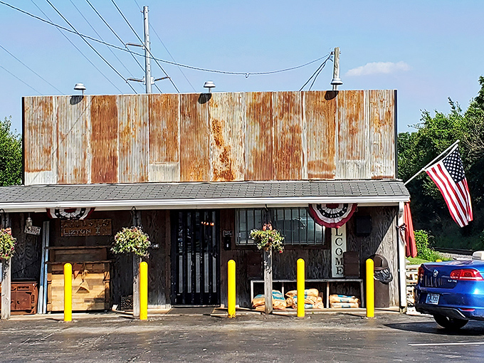 Rustic charm at its finest! This weathered metal roof and American flag scream "authentic BBQ hideaway" before you even smell the smoke.