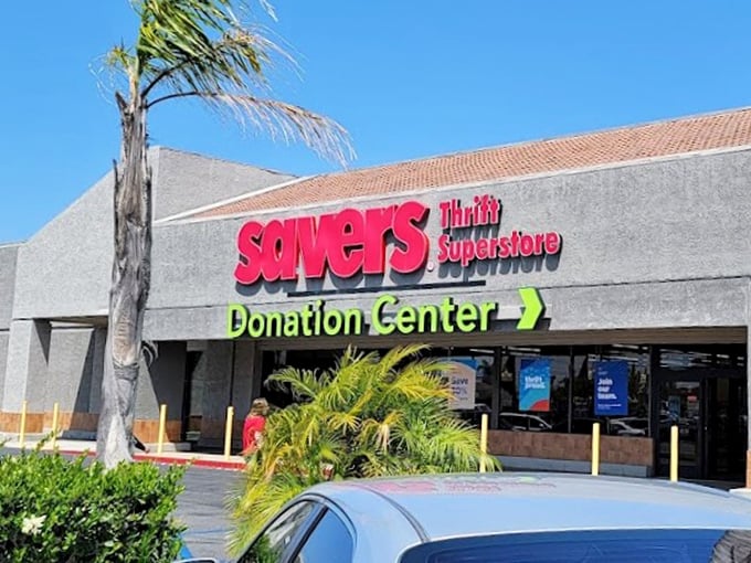The bright red Savers sign beckons like a lighthouse for bargain hunters. Thrift paradise awaits inside!