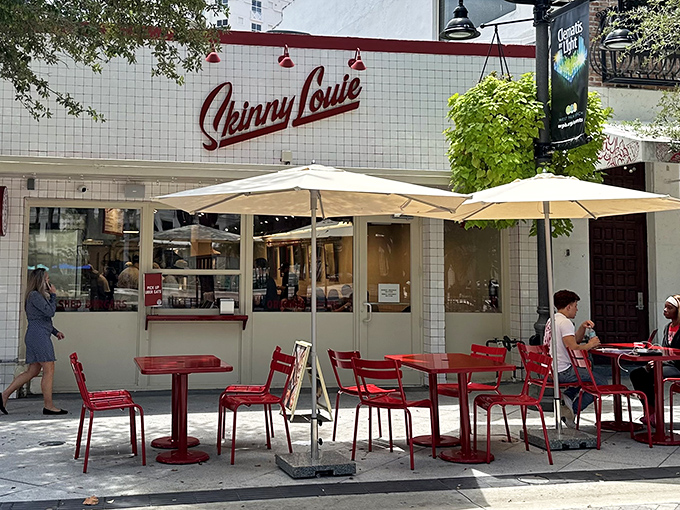 Skinny Louie's white-tiled facade and bold red script sign promise burger greatness. Those red tables are calling your name!