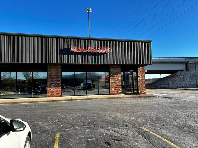 Smokin' Notes BBQ's storefront might look unassuming, but that red neon sign promises smoky symphonies for your taste buds.