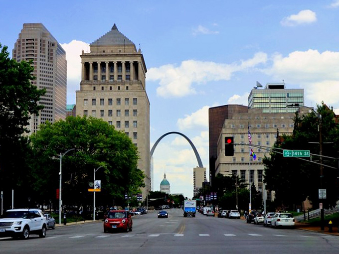 Downtown dreams! St. Louis streets lead to that iconic arch, like a giant metal rainbow promising affordable housing at the end.