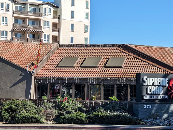 The terra cotta roof and bright signage promise seafood treasures within. Like a coastal mirage for crab lovers!