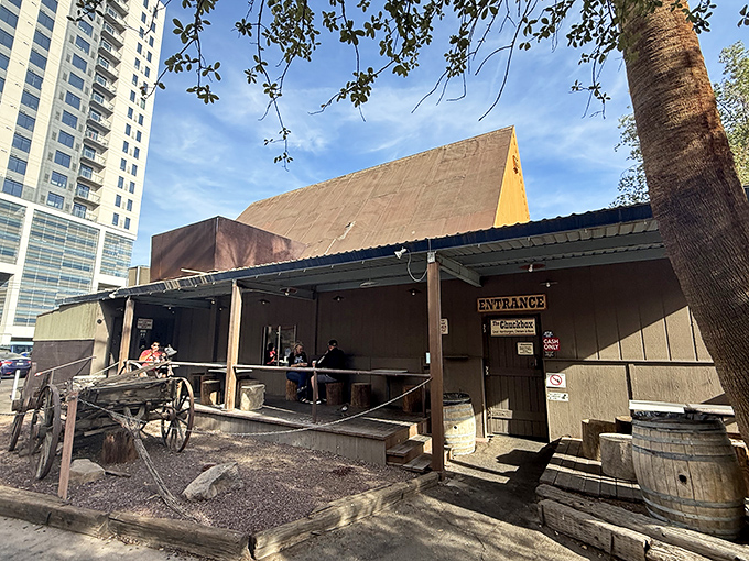 The Chuck Box: A time capsule of Old West charm standing defiantly among modern high-rises. This wooden shack promises burger nirvana inside.