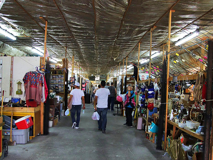Treasure hunters navigate the covered aisles of Tri Cities Flea Market, where one person's castoffs become another's prized possessions.