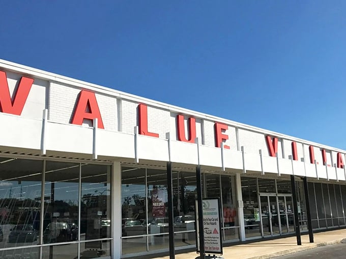 The iconic red letters of Value Village beckon like a lighthouse for bargain hunters on a treasure-seeking mission.