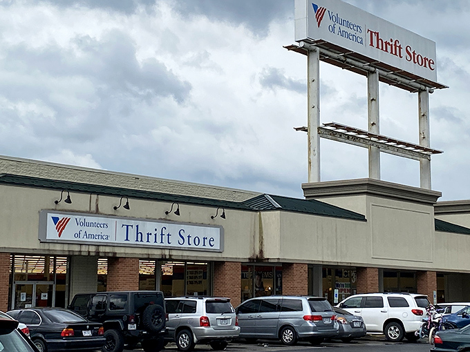 The Volunteers of America sign beckons like a lighthouse for bargain hunters. Treasures await inside this unassuming storefront!