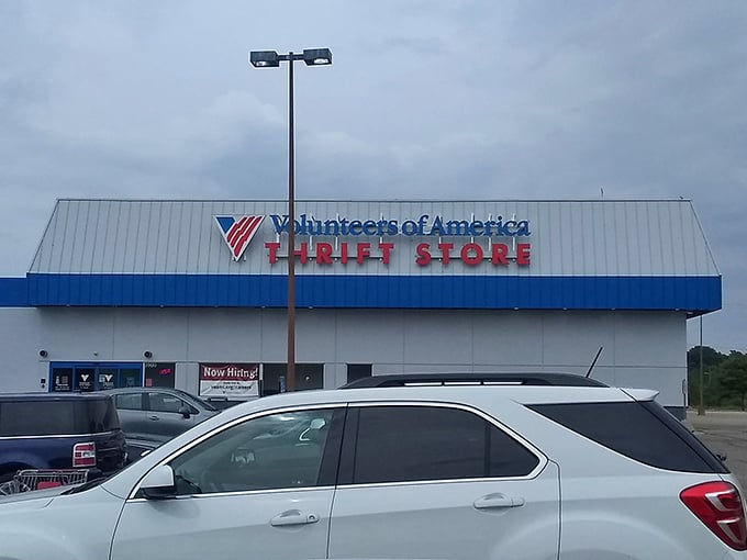 The iconic blue and white Volunteers of America storefront beckons treasure hunters with promises of hidden gems inside.