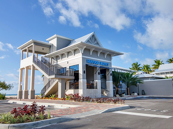 The Whale Harbor Seafood Buffet stands like a coastal palace, promising seafood treasures within those bright blue walls. Ocean breezes included at no extra charge! 