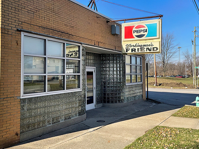 The unassuming brick exterior of Workingman's Friend hides burger greatness within. That vintage Pepsi sign has witnessed decades of satisfied customers.
