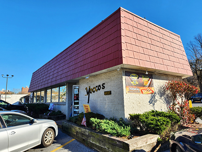 Yocco's iconic red-roofed building stands like a beacon of hope for hungry travelers. The hot dog promised land awaits inside!