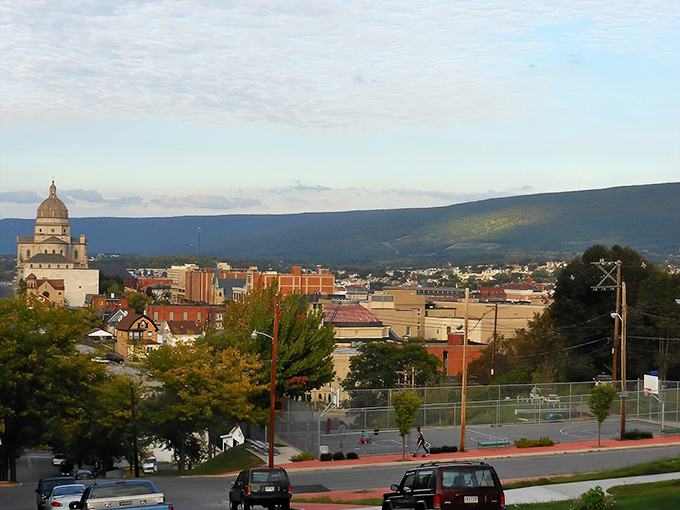 The historic skyline of Altoona sits nestled against mountain backdrops, where railroad heritage meets small-town charm.
