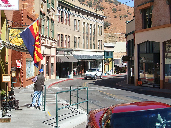 The Arizona flag flutters proudly over Bisbee's historic downtown, where century-old buildings now house art galleries and quirky shops.