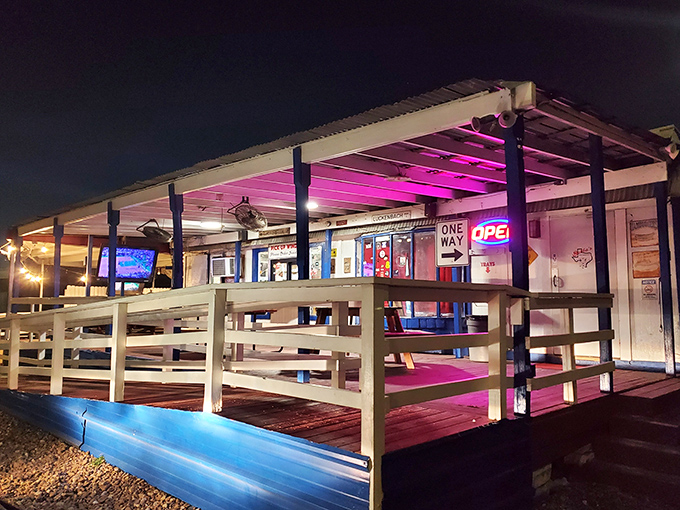 Night falls, but Bubba's neon glow beckons burger lovers to this roadside treasure. Those pink lights promise delicious things inside!