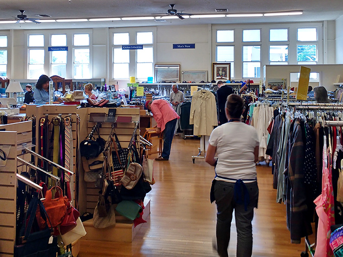 Inside CP Thrift Shop, organized racks create a treasure map where X marks the spot for your next great find.