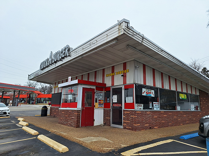 The neon sign beckons like an old friend on a dark highway. Chuck-A-Burger's vintage charm promises burgers that taste like childhood memories.