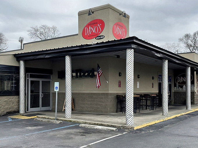 Simple, unpretentious, and proudly local &ndash; Dano's exterior promises authentic pizza without the fuss. The American flag adds a patriotic touch.