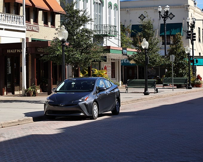 Colorful buildings stand shoulder to shoulder like old friends sharing secrets on DeLand's charming main street.