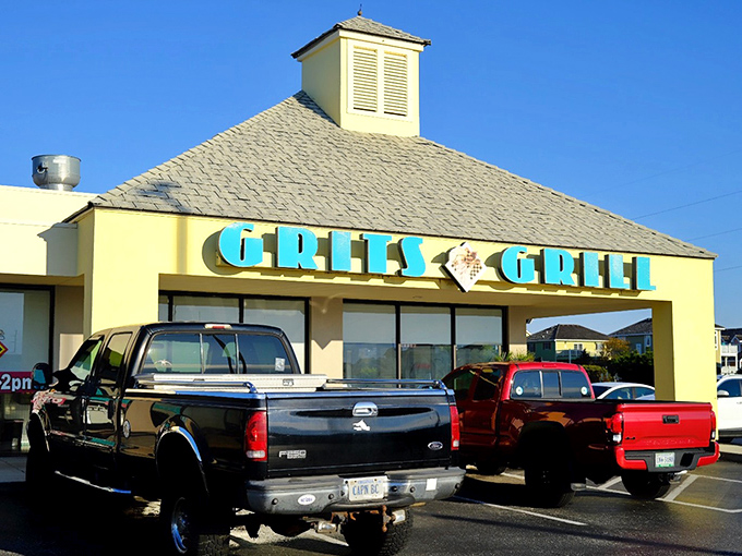 Morning sunshine gleams off Grits Grill's cheerful yellow building &ndash; where breakfast dreams come true on the Outer Banks.