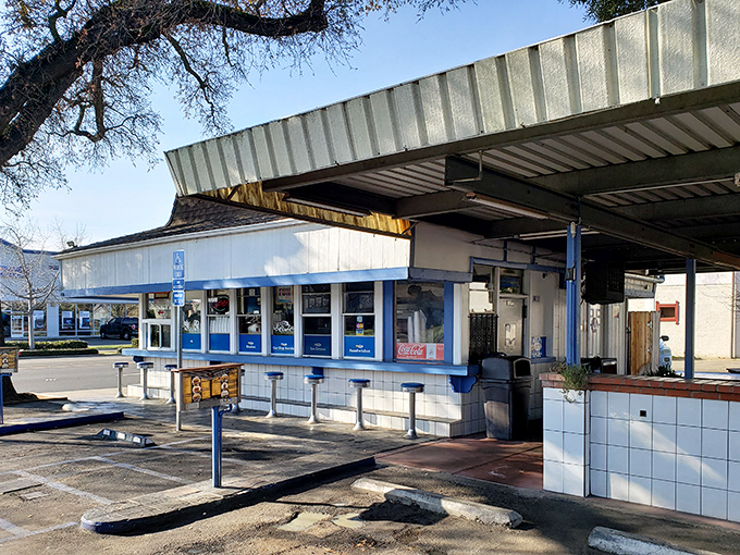 Classic drive-in architecture meets modern convenience - where chrome bumpers and comfort food create perfect harmony.