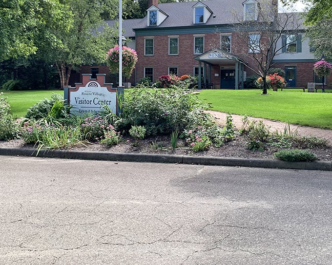 The Visitor Center welcomes you with lush gardens and that "come on in" charm that's pure small-town Ohio magic.