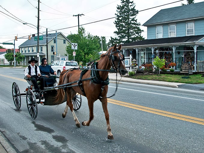 Two worlds collide in Intercourse, where Amish buggies and colorful storefronts create a living postcard of American cultural diversity.