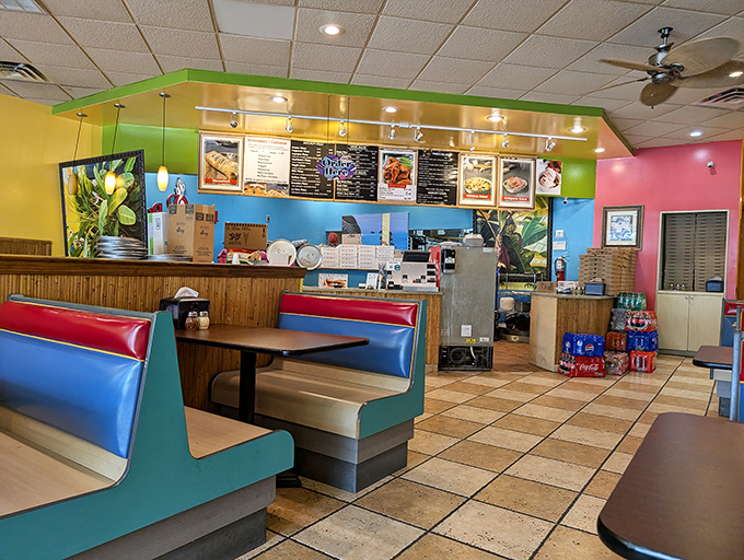 Retro booths and vibrant colors create the perfect backdrop for pizza perfection. Comfort never goes out of style.