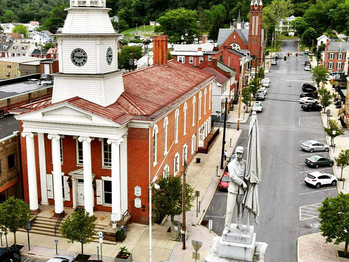 The stately courthouse with its gleaming white clock tower stands sentinel over Lewistown, like time itself watching over the town.