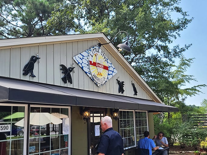 Look for those bird silhouettes! Little City Diner's charming sign promises a breakfast worth crowing about.