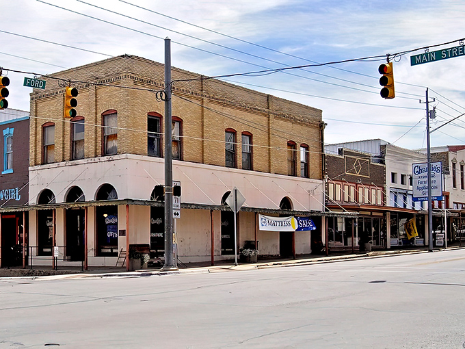 Corner of small-town dreams! Llano's brick buildings have witnessed more Texas tales than a Willie Nelson songbook.