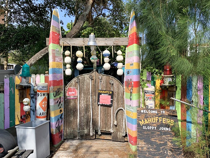 Rainbow-painted posts and buoys welcome brave souls to what locals proudly call "Florida's worst dive bar."
