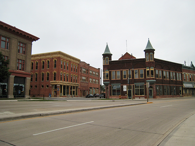 Classic storefronts line the street like old friends gathering for coffee, each one holding decades of community memories.