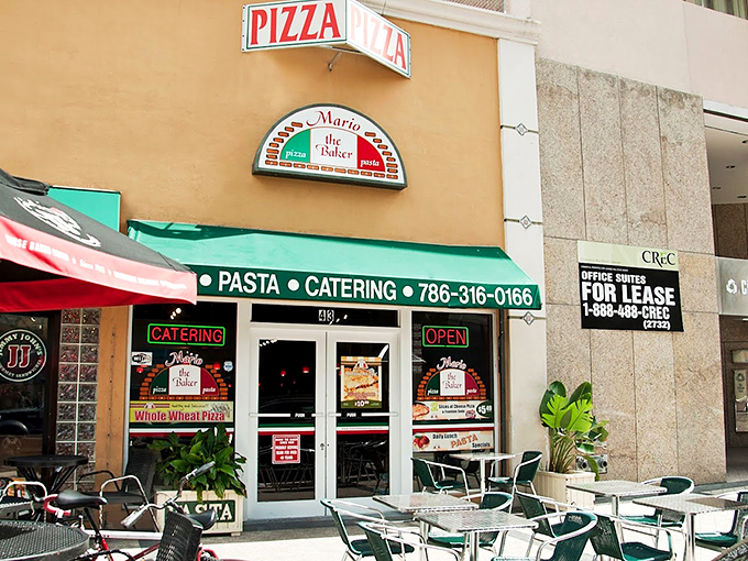 That green awning beckons like a beacon for pizza pilgrims seeking authentic Italian flavors.