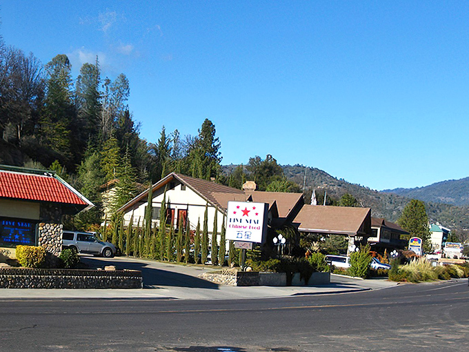 Oakhurst's main street at sunset &ndash; where small-town charm meets the golden glow of Sierra foothills.