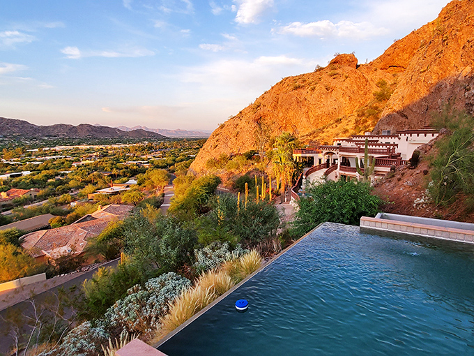 Who needs a vacation when your backyard looks like this? The infinity pool seemingly melts into the desert landscape, creating nature's perfect retirement postcard.