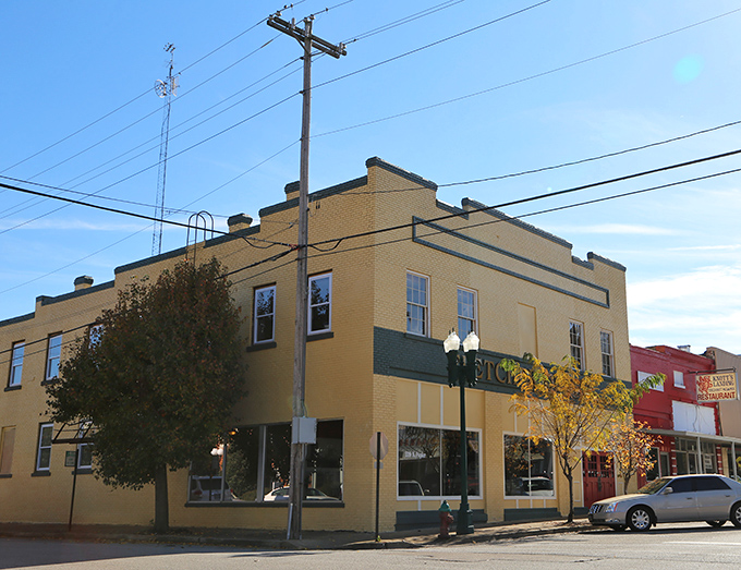 Small-town America at its finest! This yellow brick building in Paris stands proudly at the corner, a testament to simpler times.