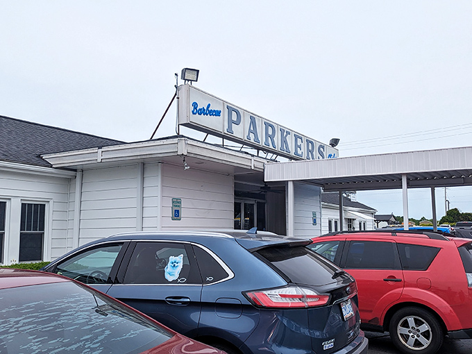 The classic blue and white sign at Parker's promises barbecue paradise inside. Like a lighthouse for hungry travelers, it guides you to smoky, chopped pork perfection.