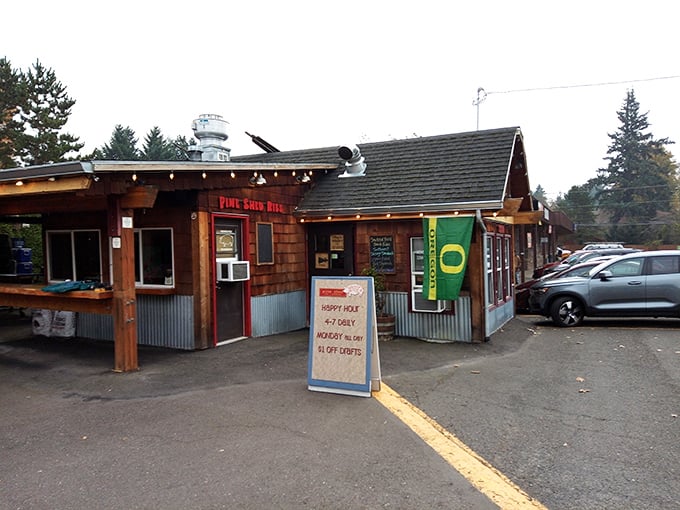 Oregon Ducks flag flying proudly outside Pine Shed Ribs &ndash; where college football and slow-smoked meats create the perfect weekend lineup.