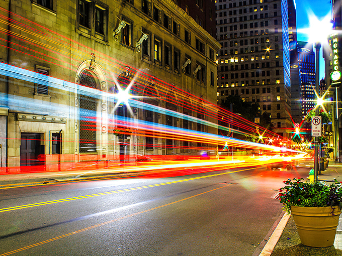 City lights dance through Pittsburgh like fireflies, painting the night with promises of affordable adventures.