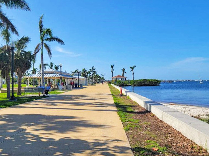 Stroll along Punta Gorda's palm-lined waterfront path where retirement dreams meet gentle Gulf breezes.