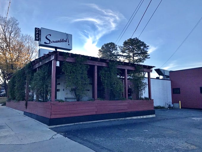 Scrambled's vine-covered pergola hints at the hidden breakfast treasure within, like a secret garden for pancake lovers.