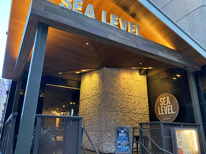 That glowing "Sea Level" sign isn't just a name&mdash;it's a promise of coastal treasures served miles from any beach.