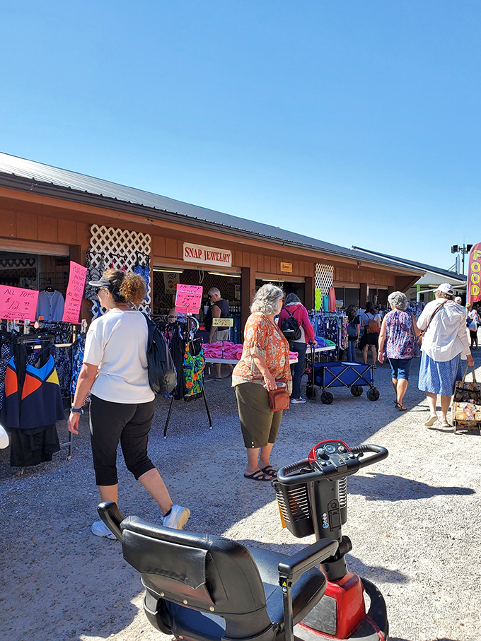 Bargain hunters navigate the bustling aisles at Shipshewana, where mobility scooters are the Ferrari of flea market transportation.