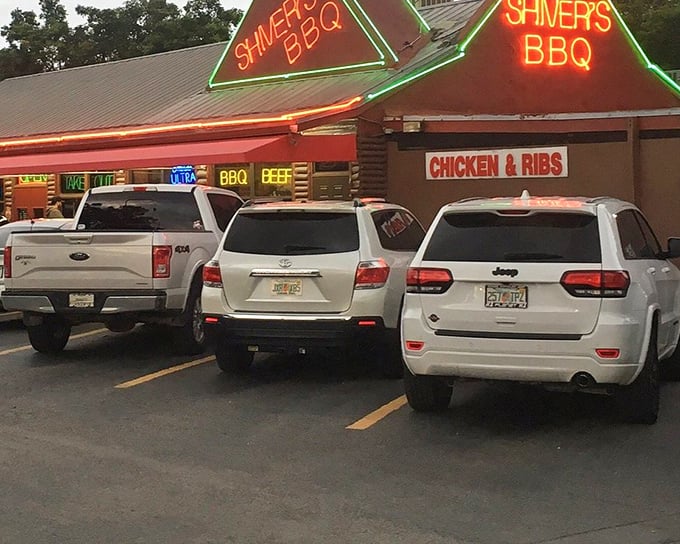 Cars line up outside Shiver's BBQ where the "CHICKEN & RIBS" sign tells you exactly what you're in for. Simple pleasures, perfectly executed.