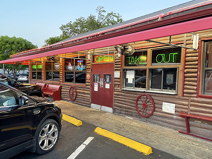 Those neon signs aren't just decoration - they're a roadmap to barbecue bliss in rustic Homestead style.