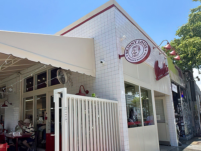 The corner view of Skinny Louie reveals its charming diner aesthetic. Simple, unpretentious, and ready to serve burger magic.
