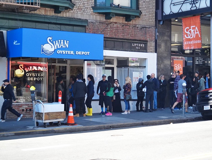 The bright blue storefront practically shouts "fresh seafood here!" while patient customers prove good things come to those who wait. 