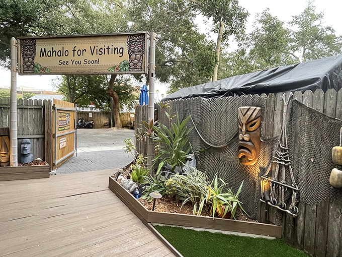 "Mahalo for visiting!" This tiki guardian stands watch, promising island flavors that'll have you planning your next visit before leaving.